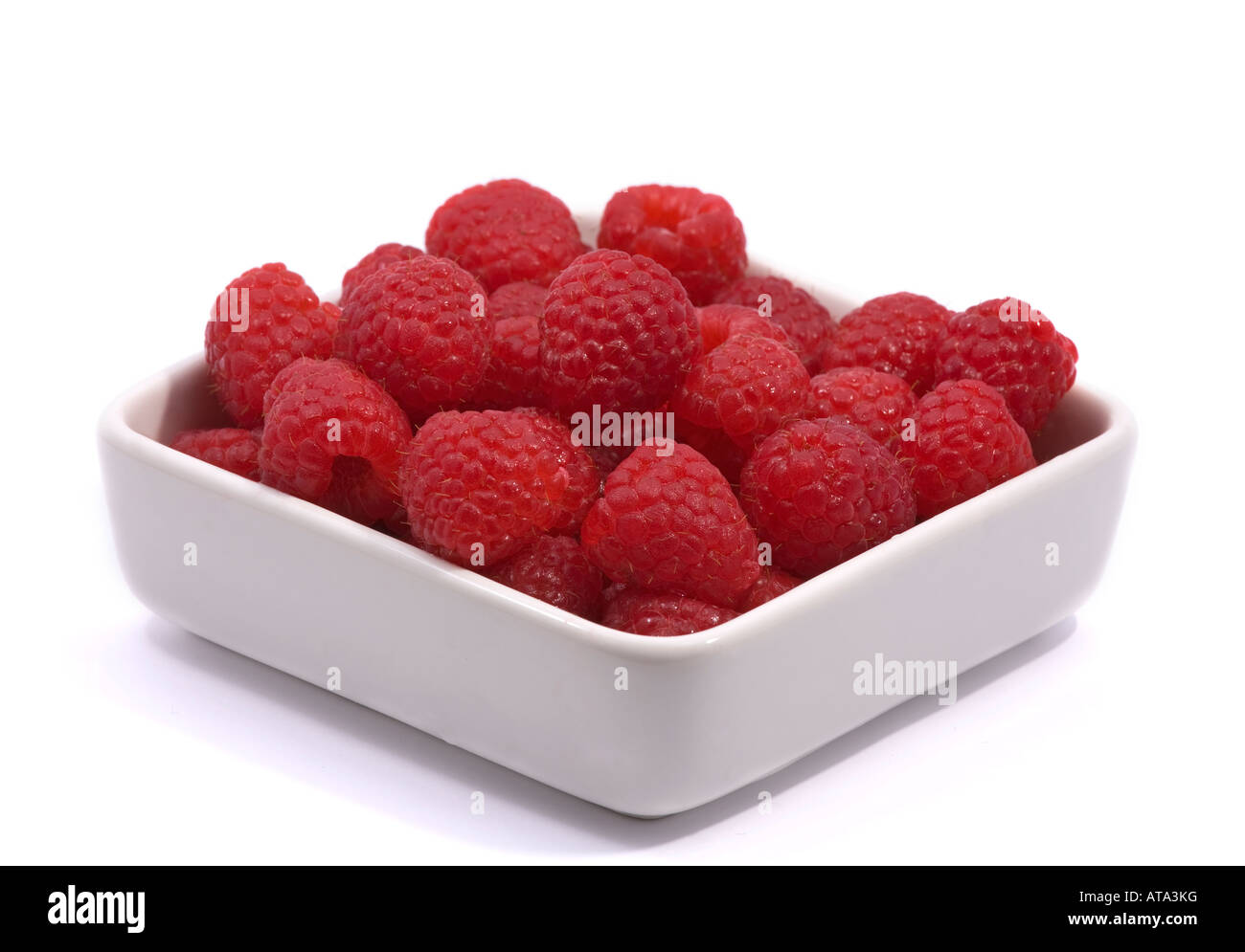 Organic raspberries in ceramic bowl Stock Photo - Alamy