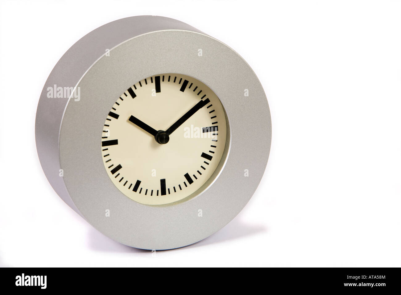 Round silver clock with hands telling ten-to-ten time Stock Photo - Alamy