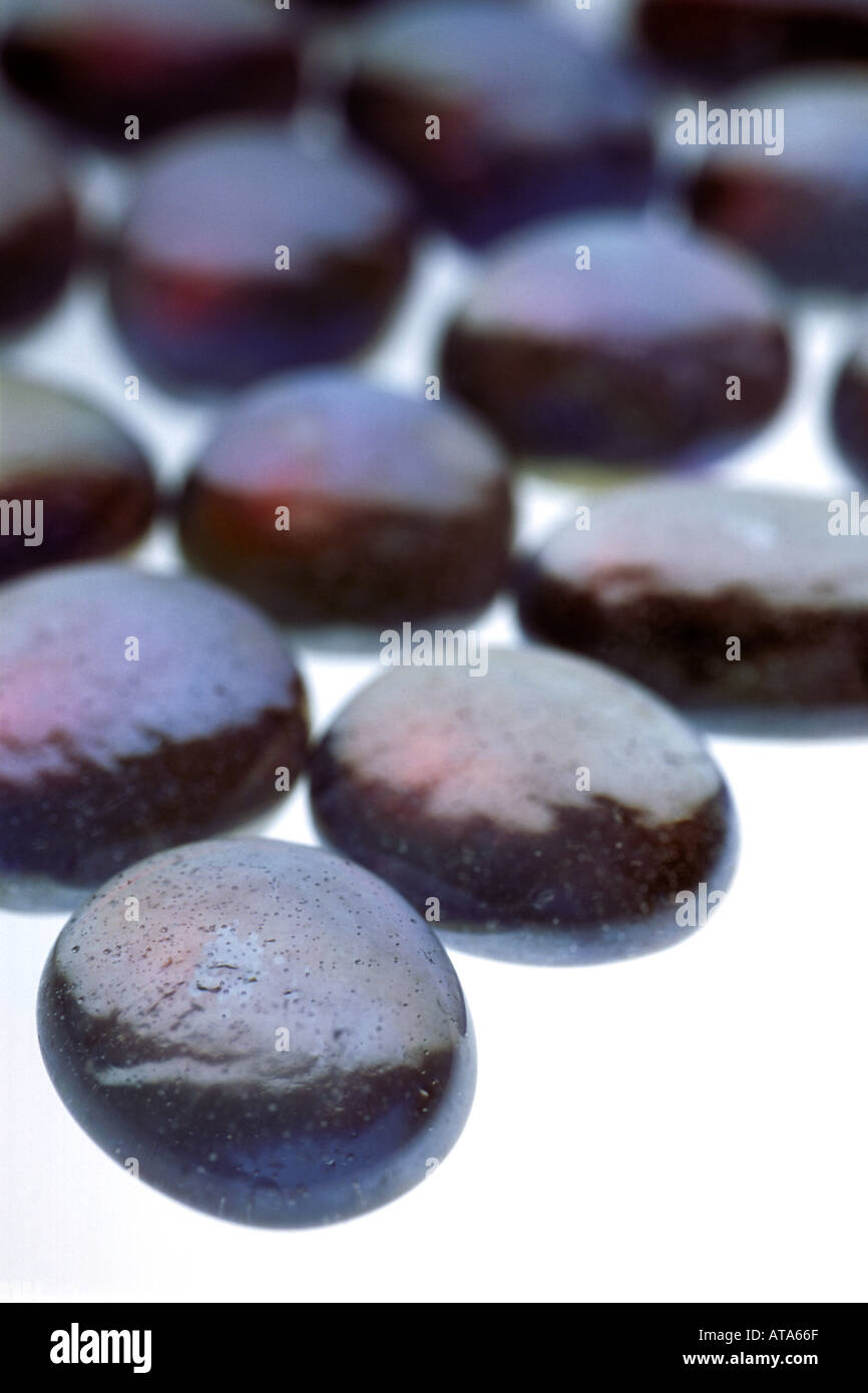 Glass pebbles on a light box Stock Photo - Alamy