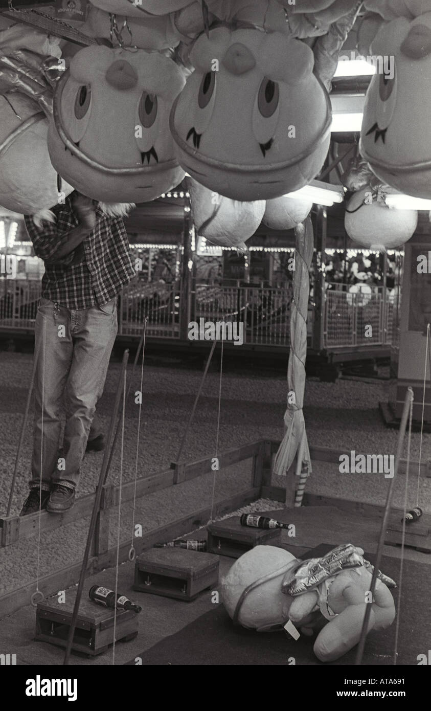 A carnival worker is surrounded by stuffed birds Stock Photo - Alamy
