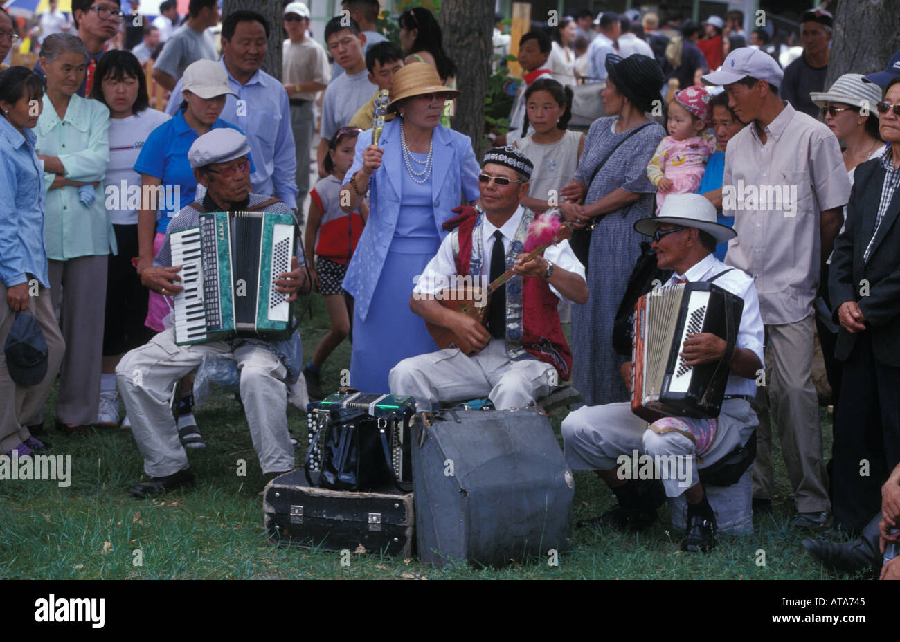Mongolian street musicians play outside the national stadium during the ...