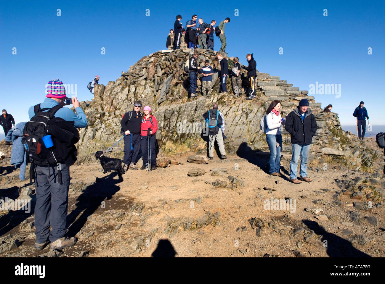 Walkers gathered on the summit of Mount Snowden, North Wales Stock ...
