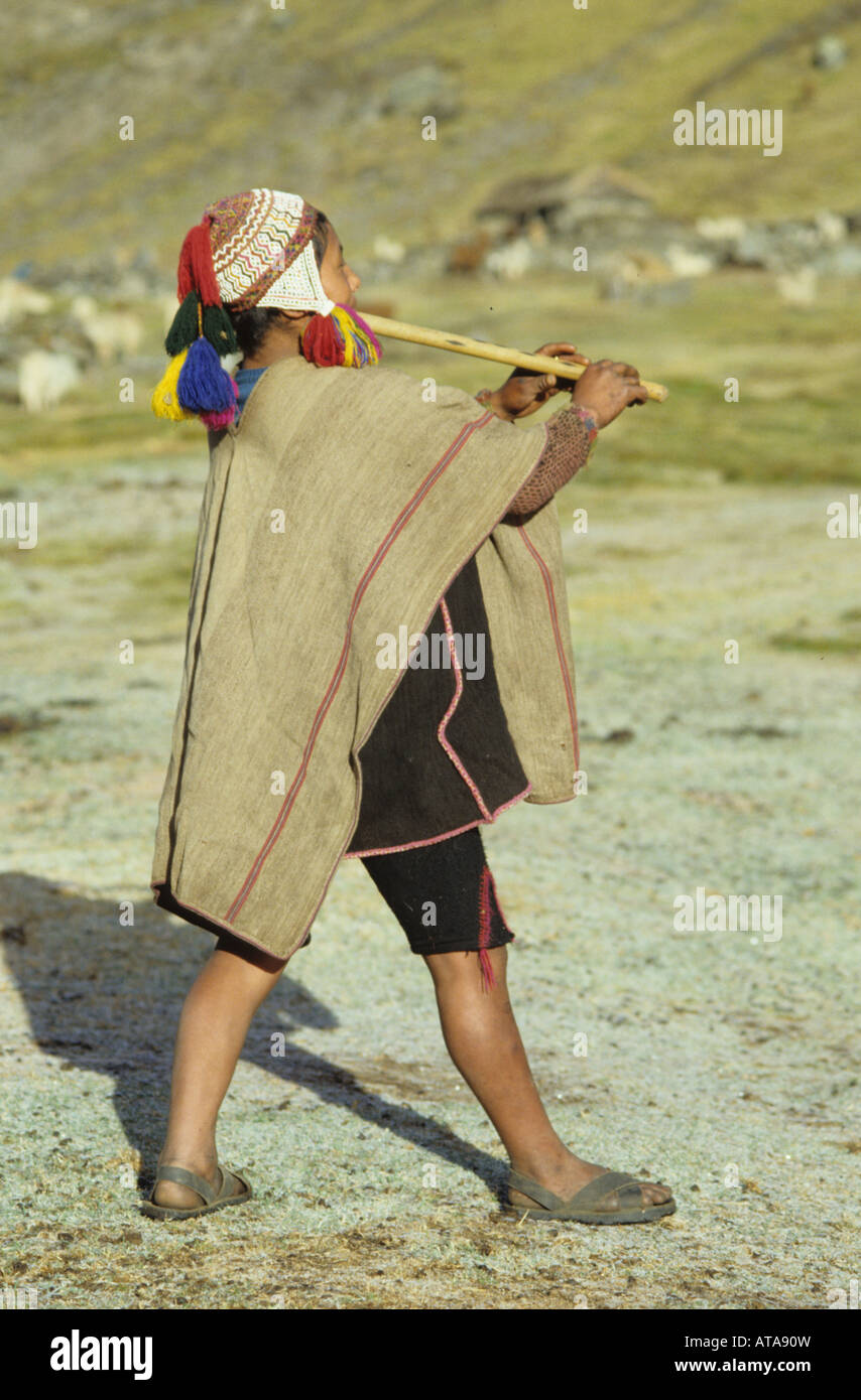 Native Quechua indian playing the quena traditional flute in Cuzco ...