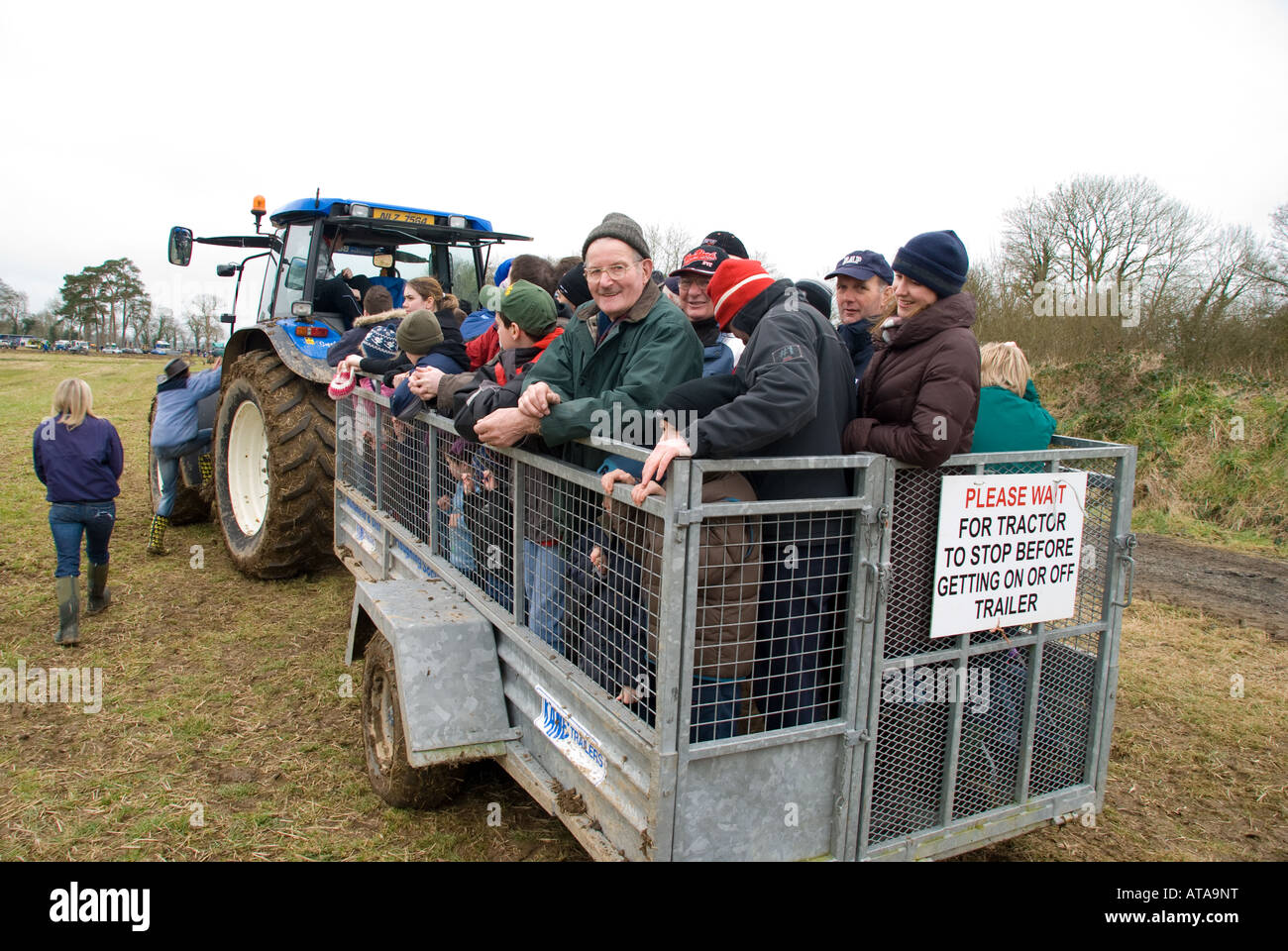 Rural Shuttle Bus (tractor and trailer) taking farmers across a field ...
