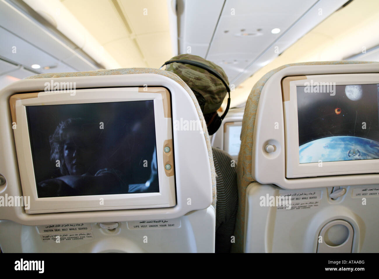 Passenger inside a plane hi-res stock photography and images - Alamy