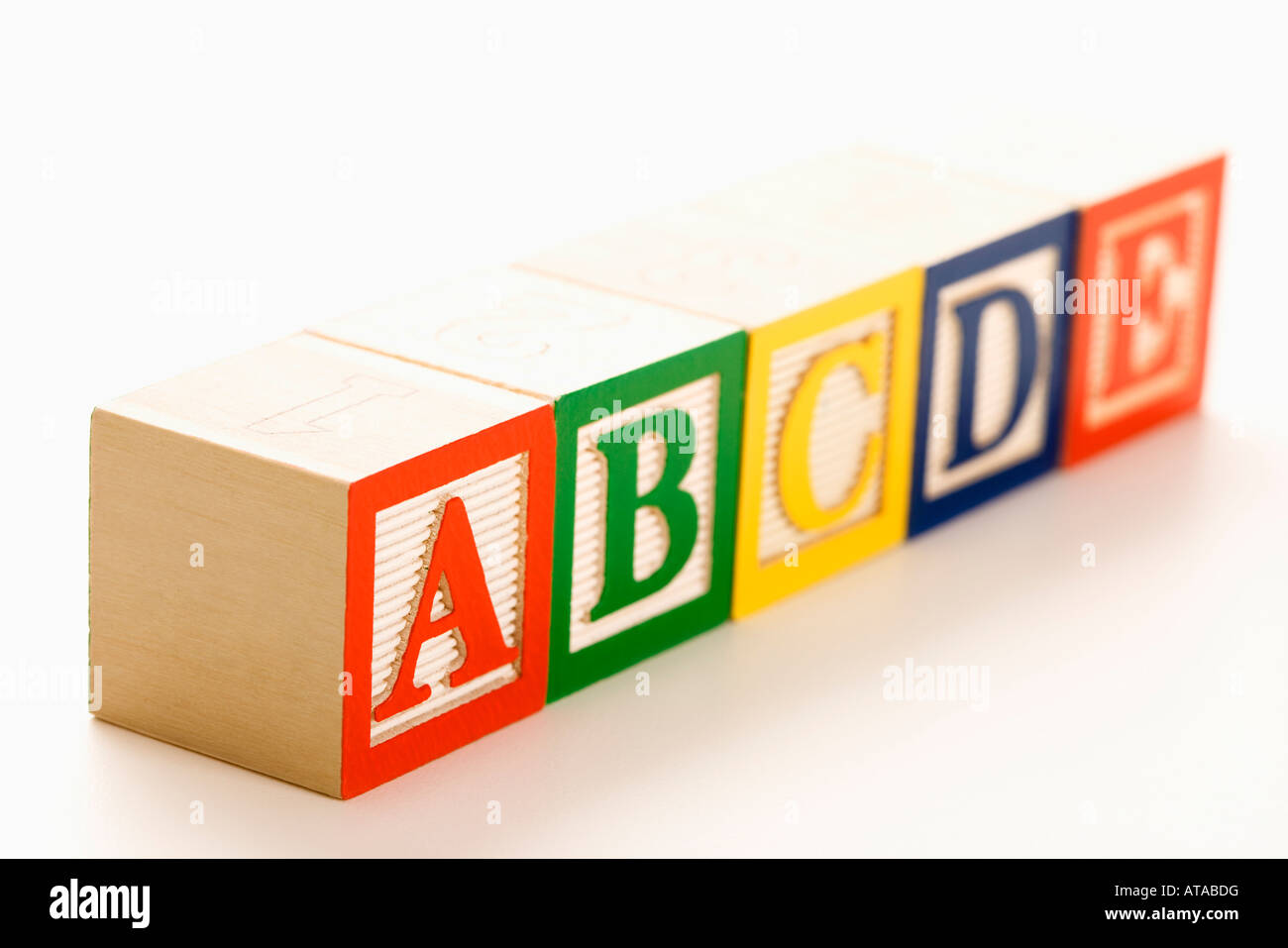 Alphabet blocks lined up in a row Stock Photo - Alamy