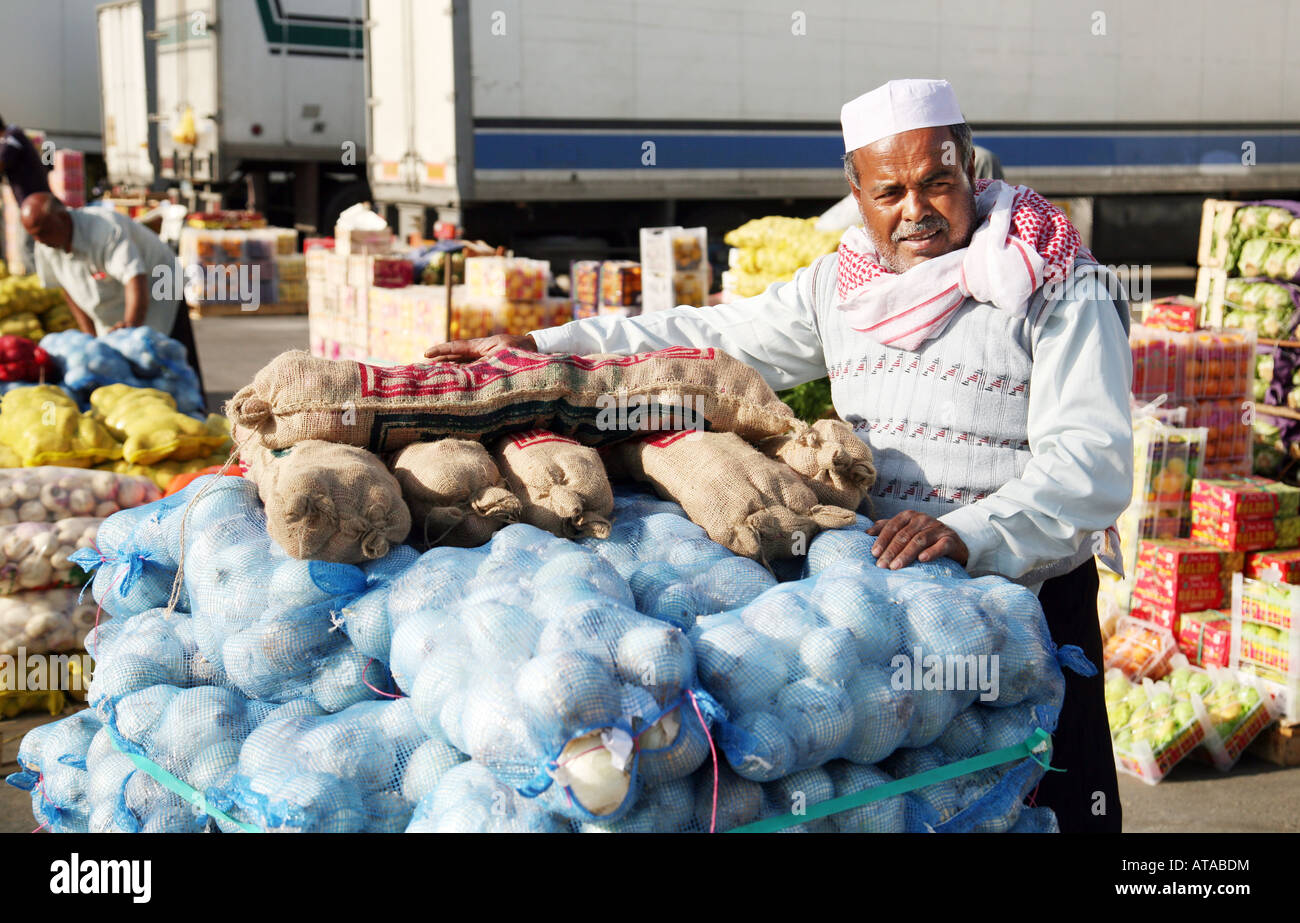 Stall keeper, vegetable market, Abu Dhabi Stock Photo - Alamy