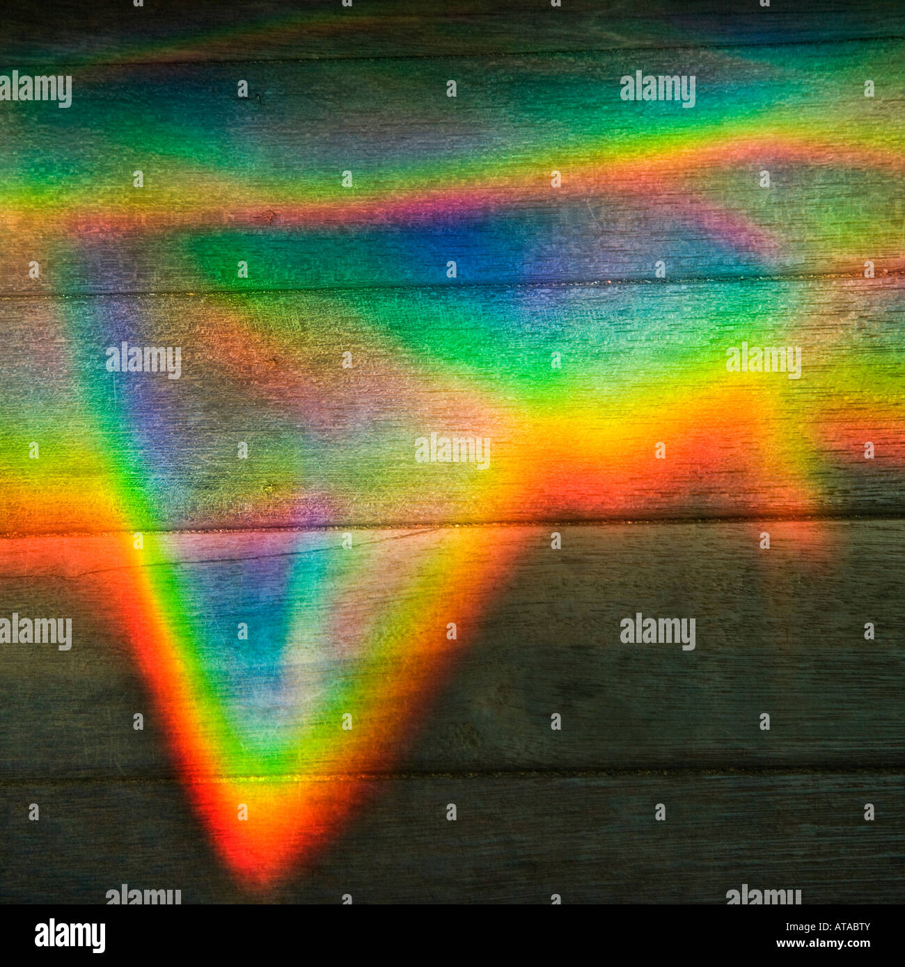 Abstract design of rainbow color prism on wood paneling Stock Photo - Alamy