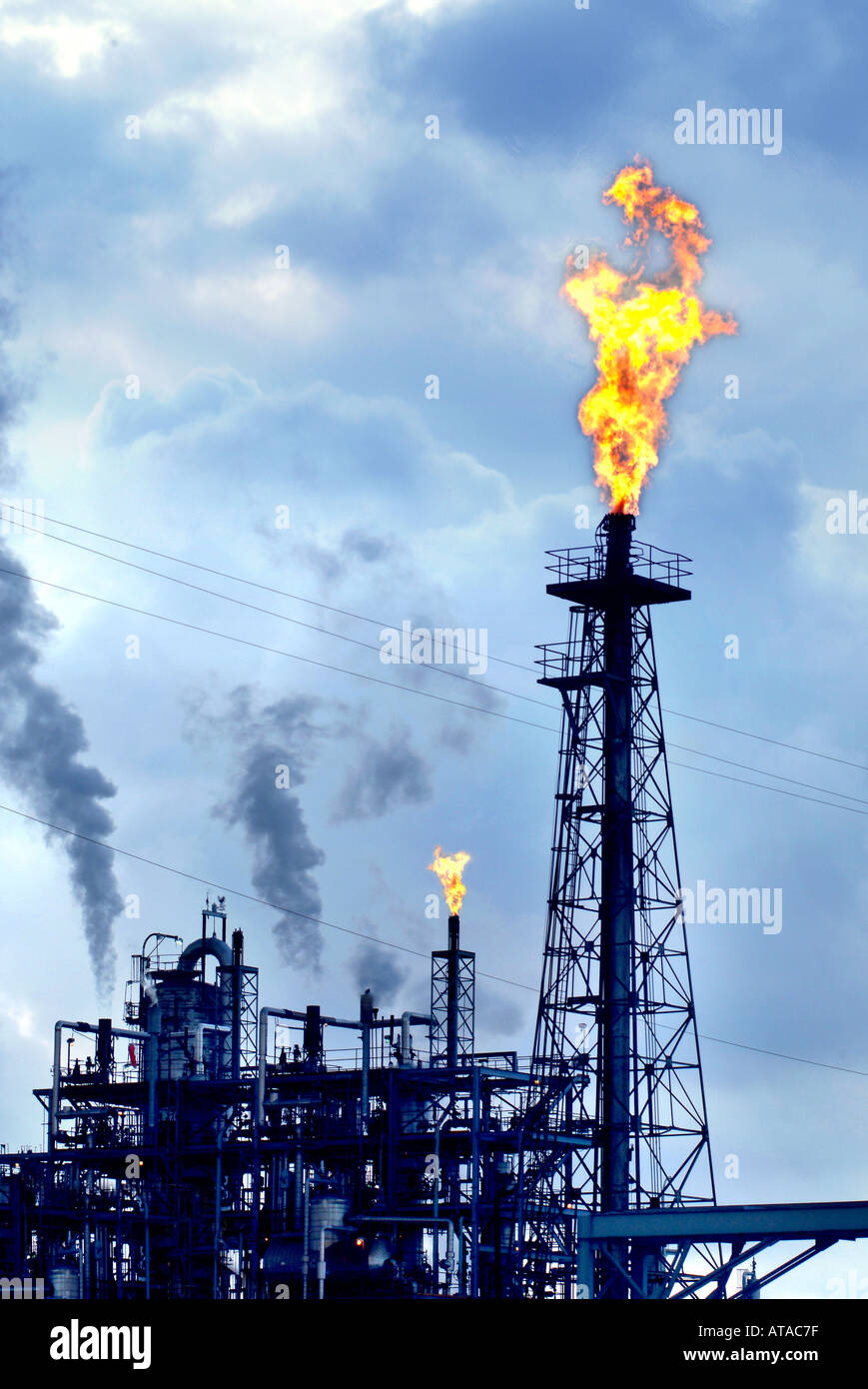 Oil refinery showing gas burn off Stock Photo - Alamy