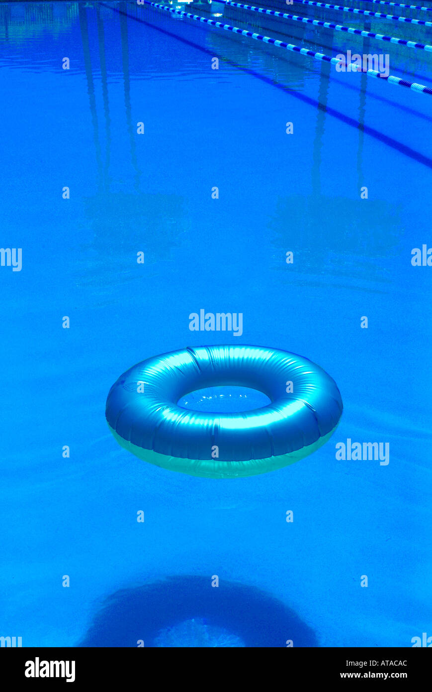 Inner tube floating in Swimming Pool Stock Photo - Alamy