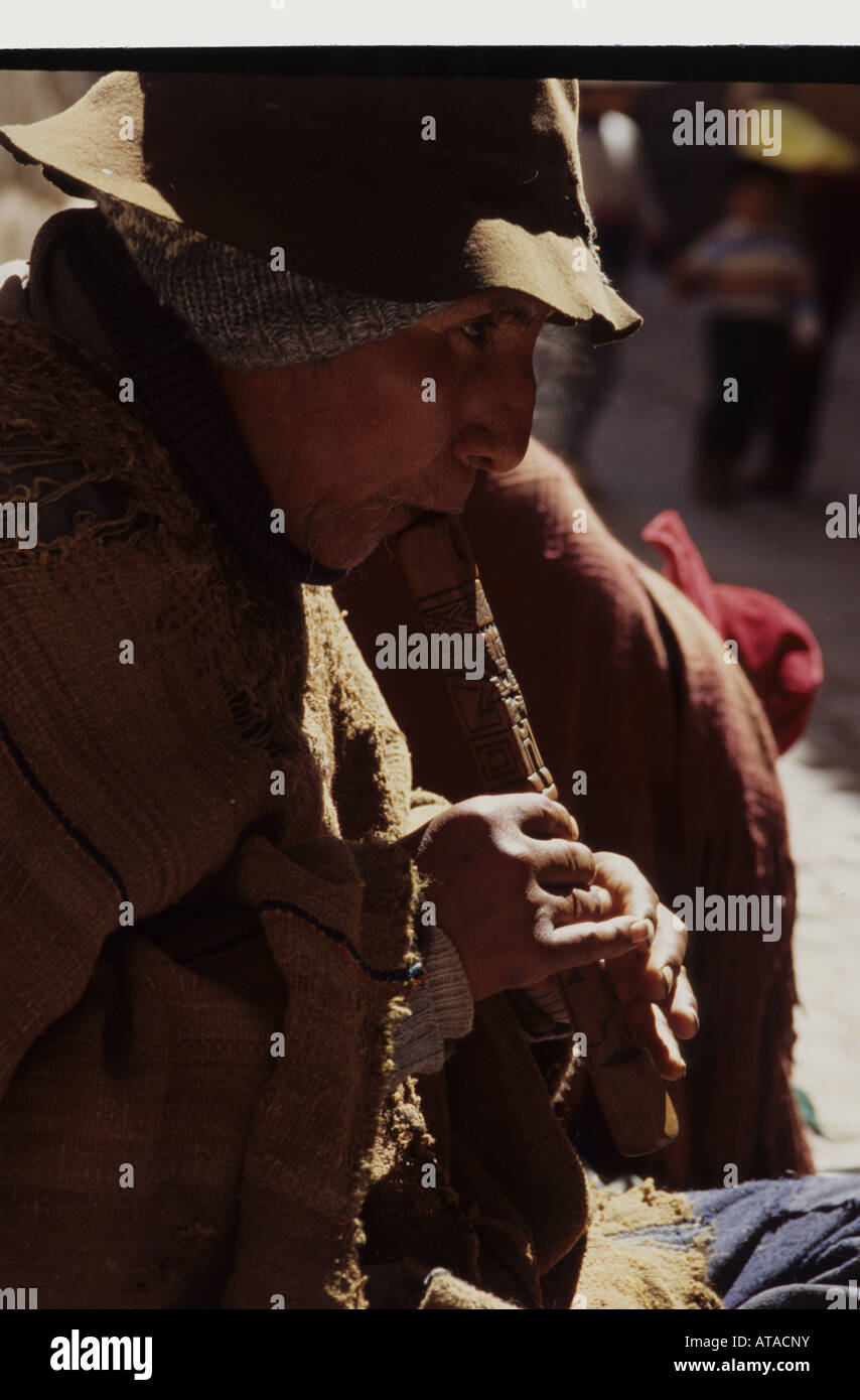 Native Quechua Indian playing the quena traditional flute in Cuzco ...