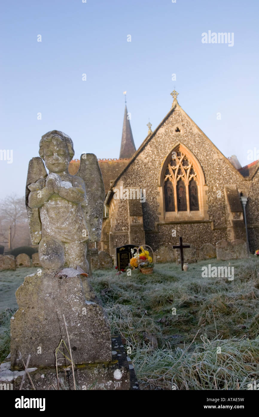 Early morning sun lights up a church and graveyard Stock Photo - Alamy