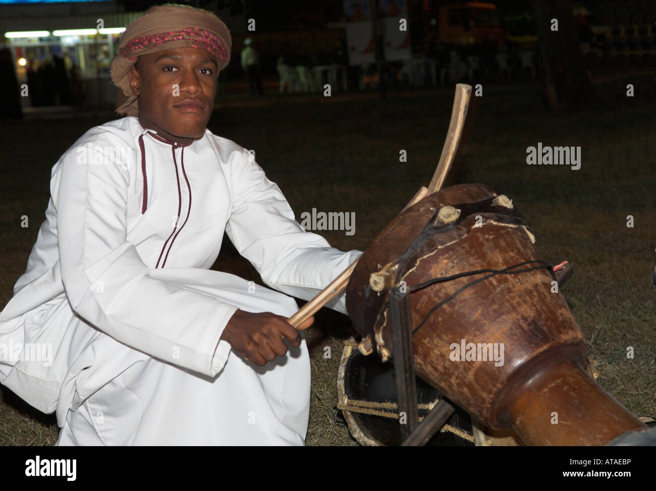 Omani man playing traditional drums at Muscat festival Oman Stock Photo ...