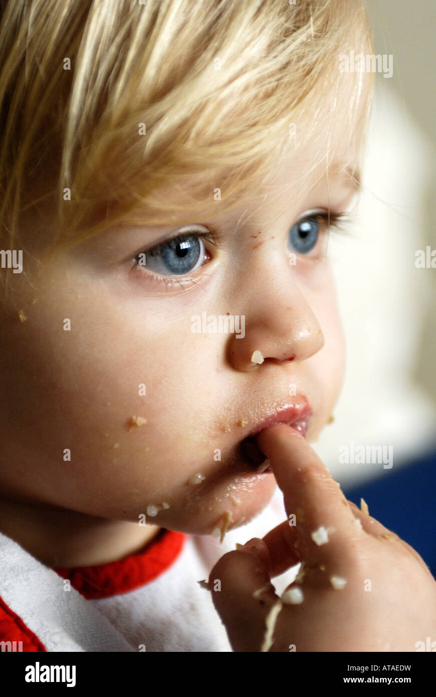 Baby boy eating Stock Photo - Alamy