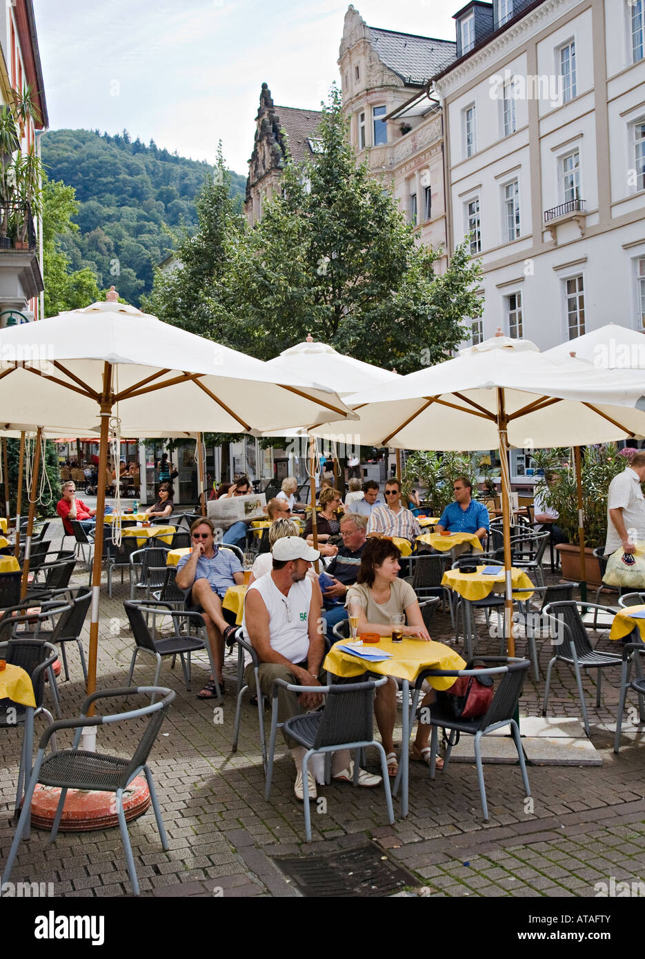 People sitting at tables at pavement cafe Heidelberg Germany Stock ...