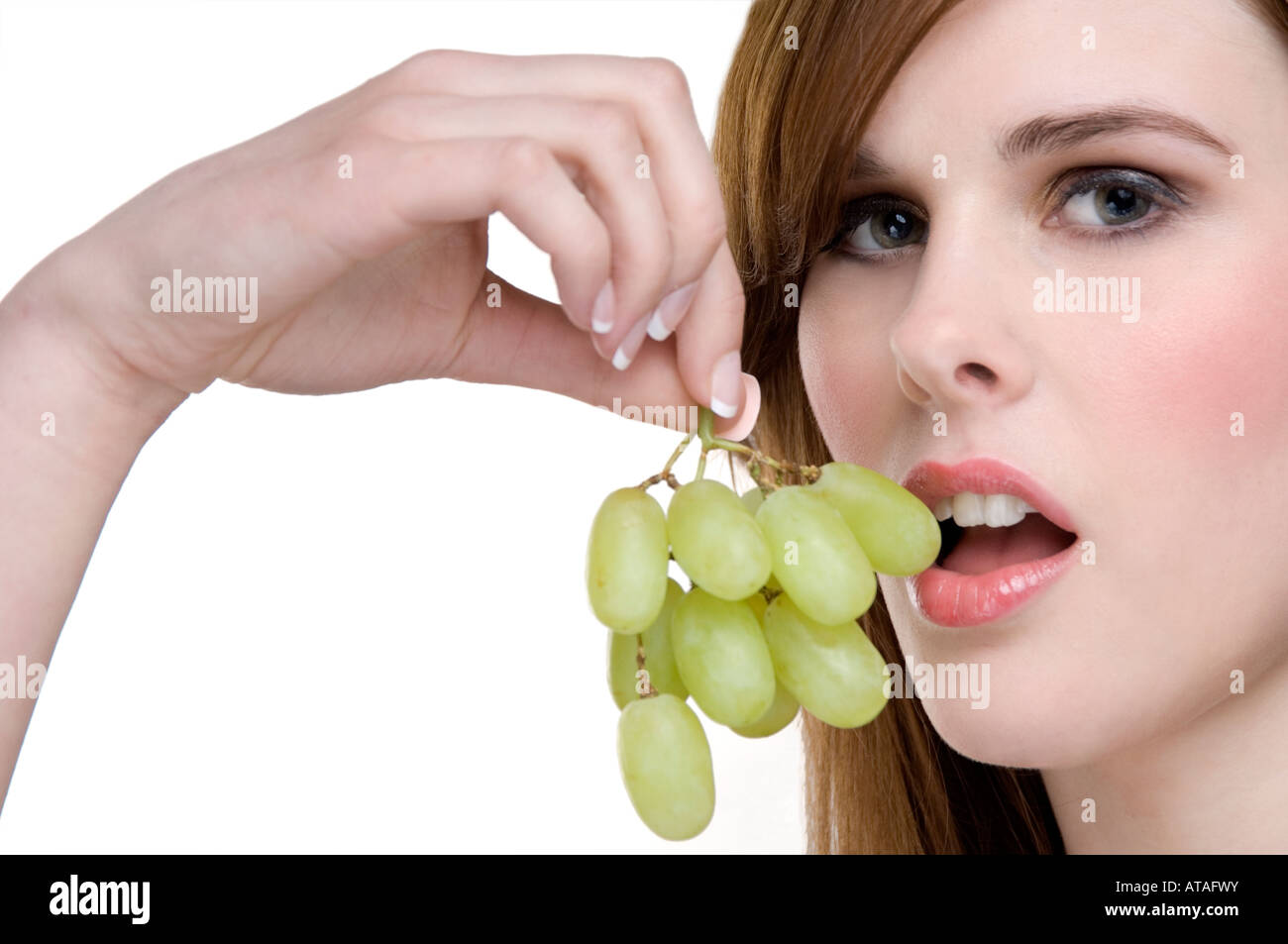 woman eating grapes Stock Photo - Alamy