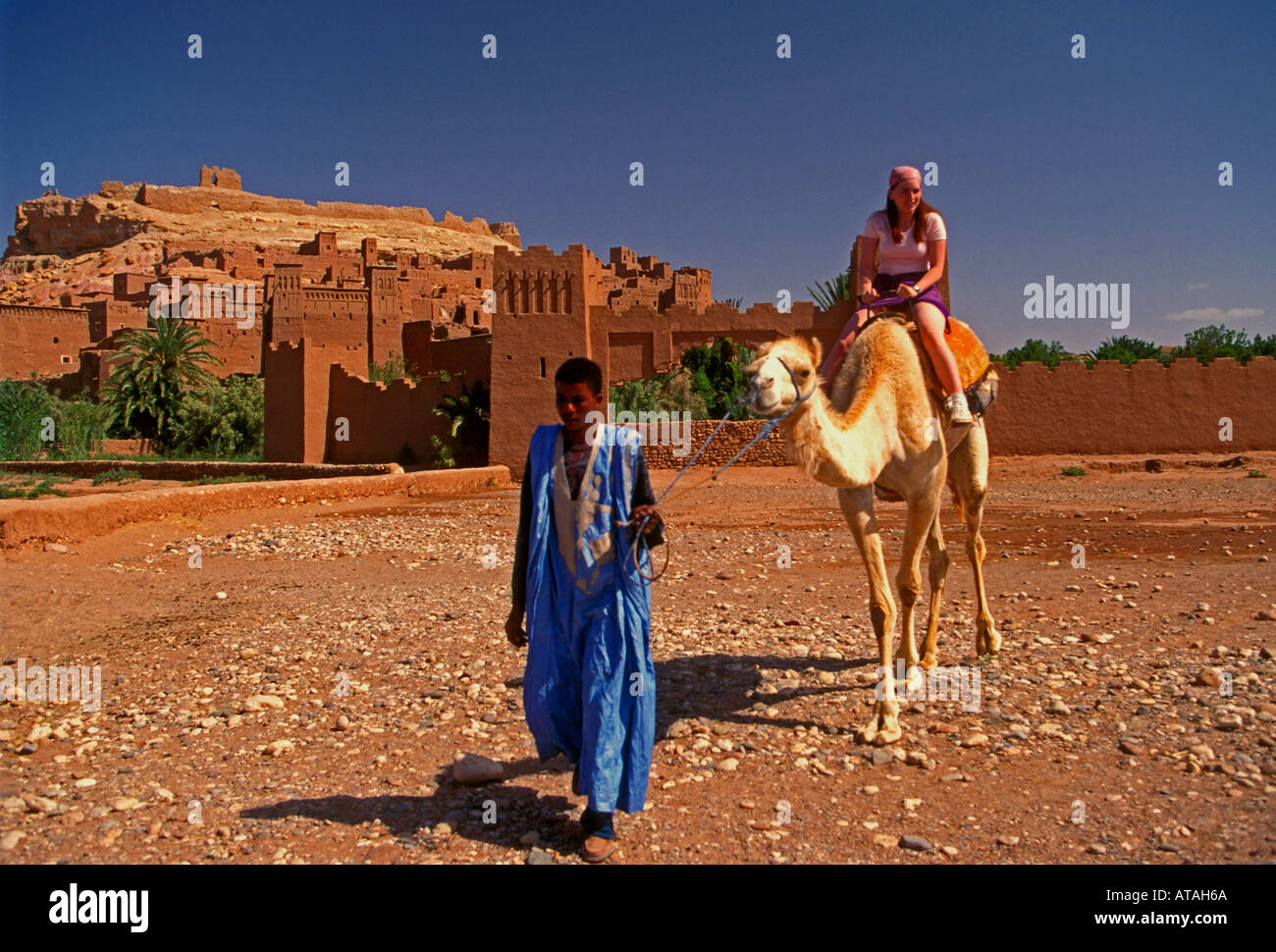 tourist riding camel, woman riding camel, camel ride, village of Ait ...