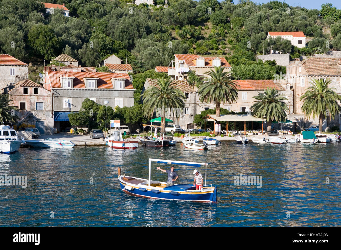 Fisherman and small boat Sipan island Croatia Stock Photo - Alamy