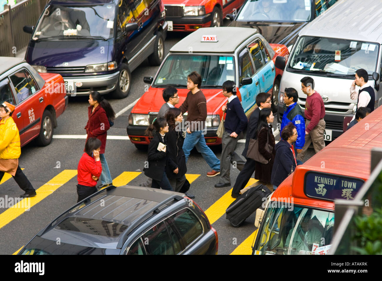 Pedestrians Crossing a Crowded Urban Street in Hong Kong Stock Photo ...
