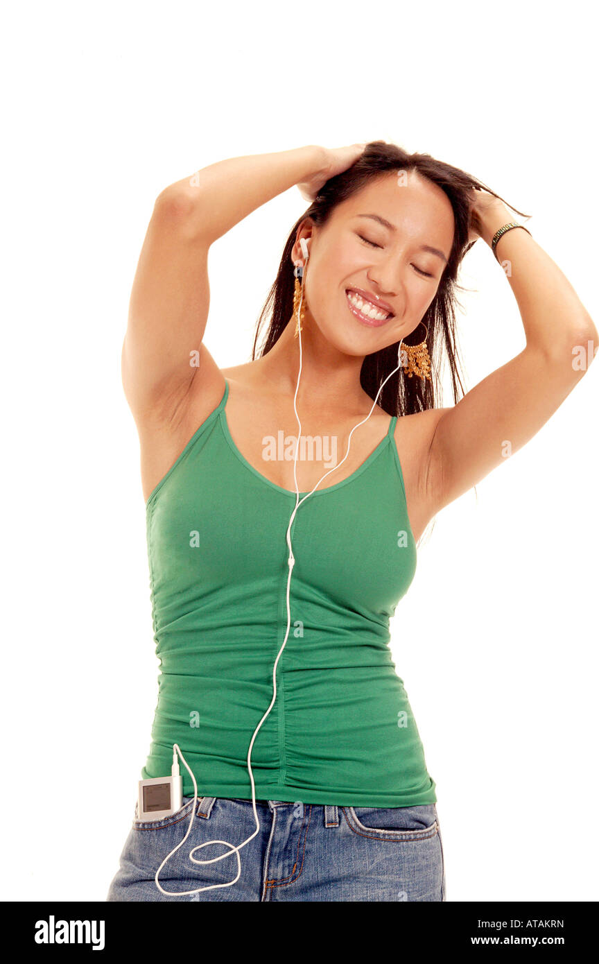 Young Woman Listening to mp3 Player with Eyes Closed Stock Photo - Alamy