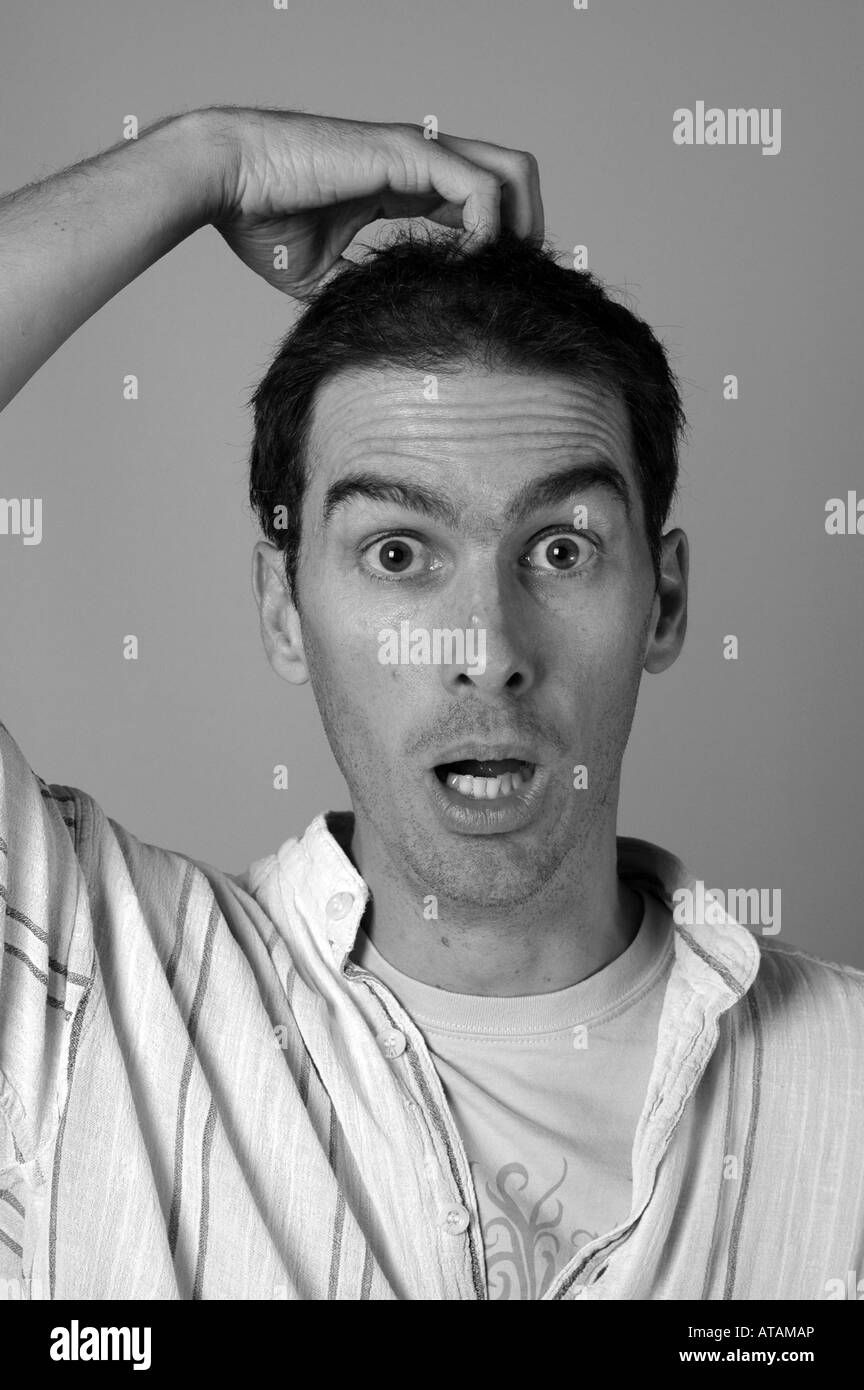 Surprised young man slightly scruffy hi-res stock photography and ...