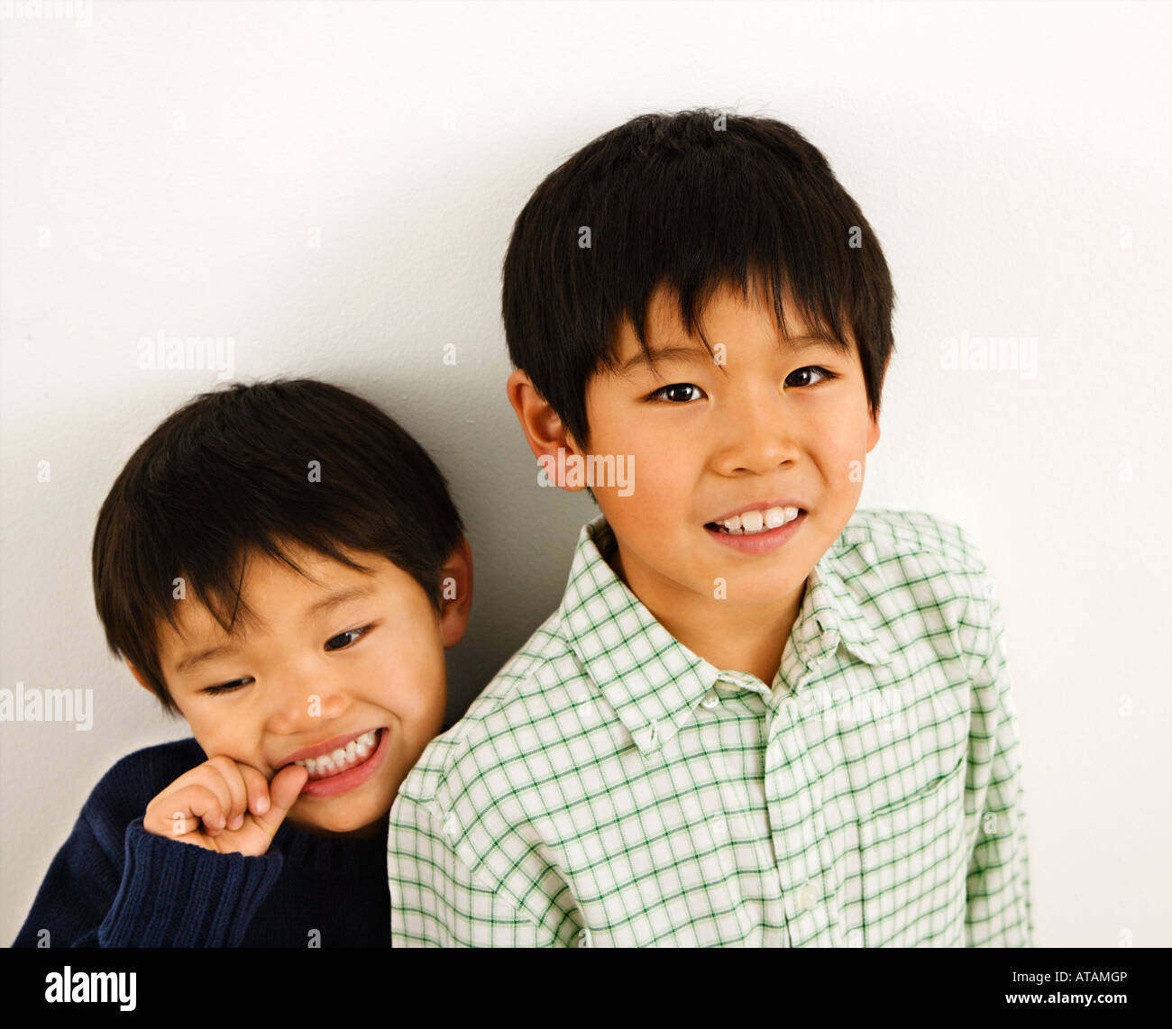 Two young Asian brothers portrait Stock Photo - Alamy