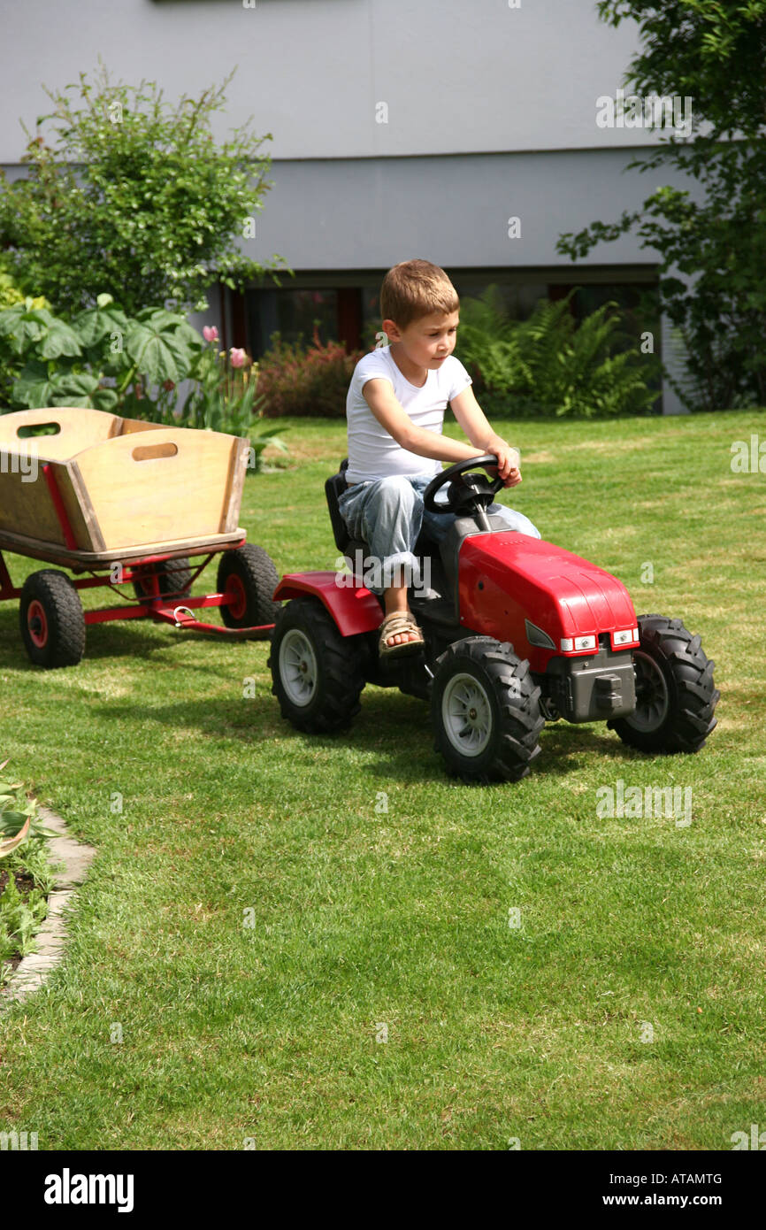Child tractor trailer not toy hi-res stock photography and images - Alamy