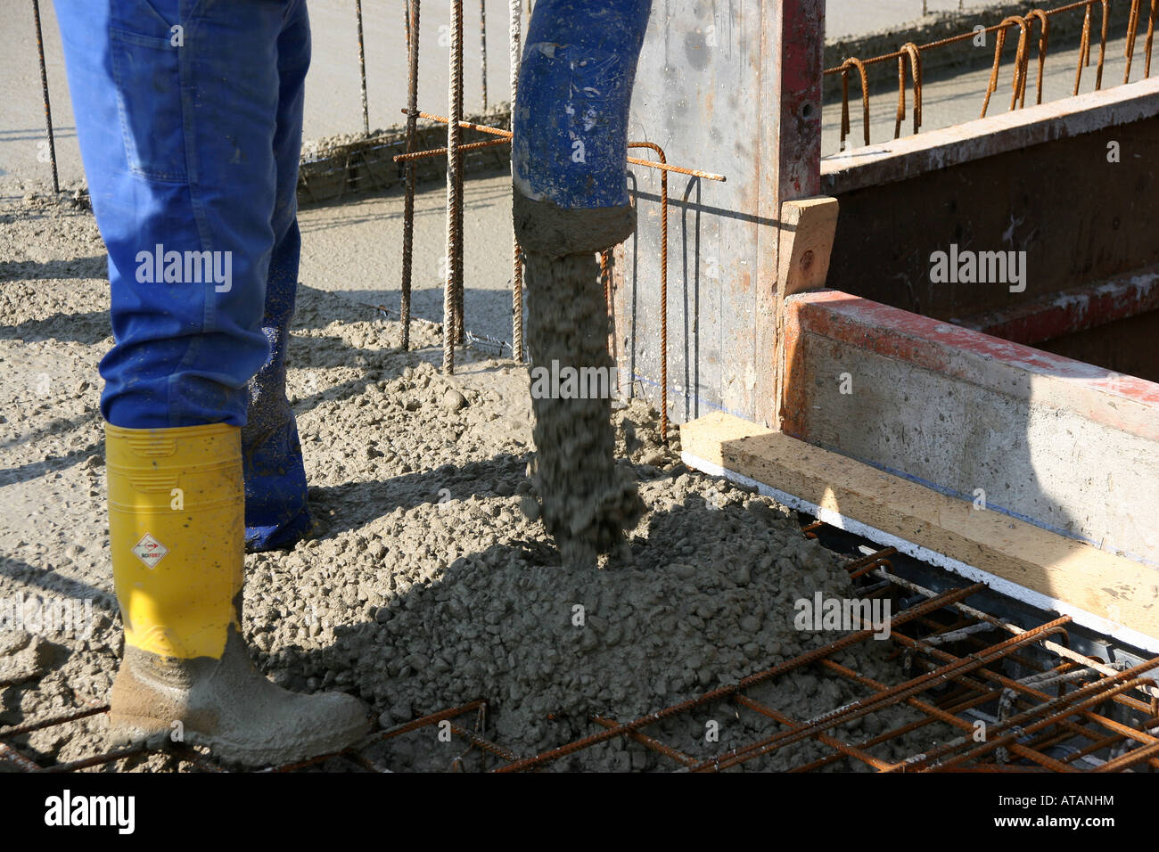 Building site worker when concreting Stock Photo - Alamy