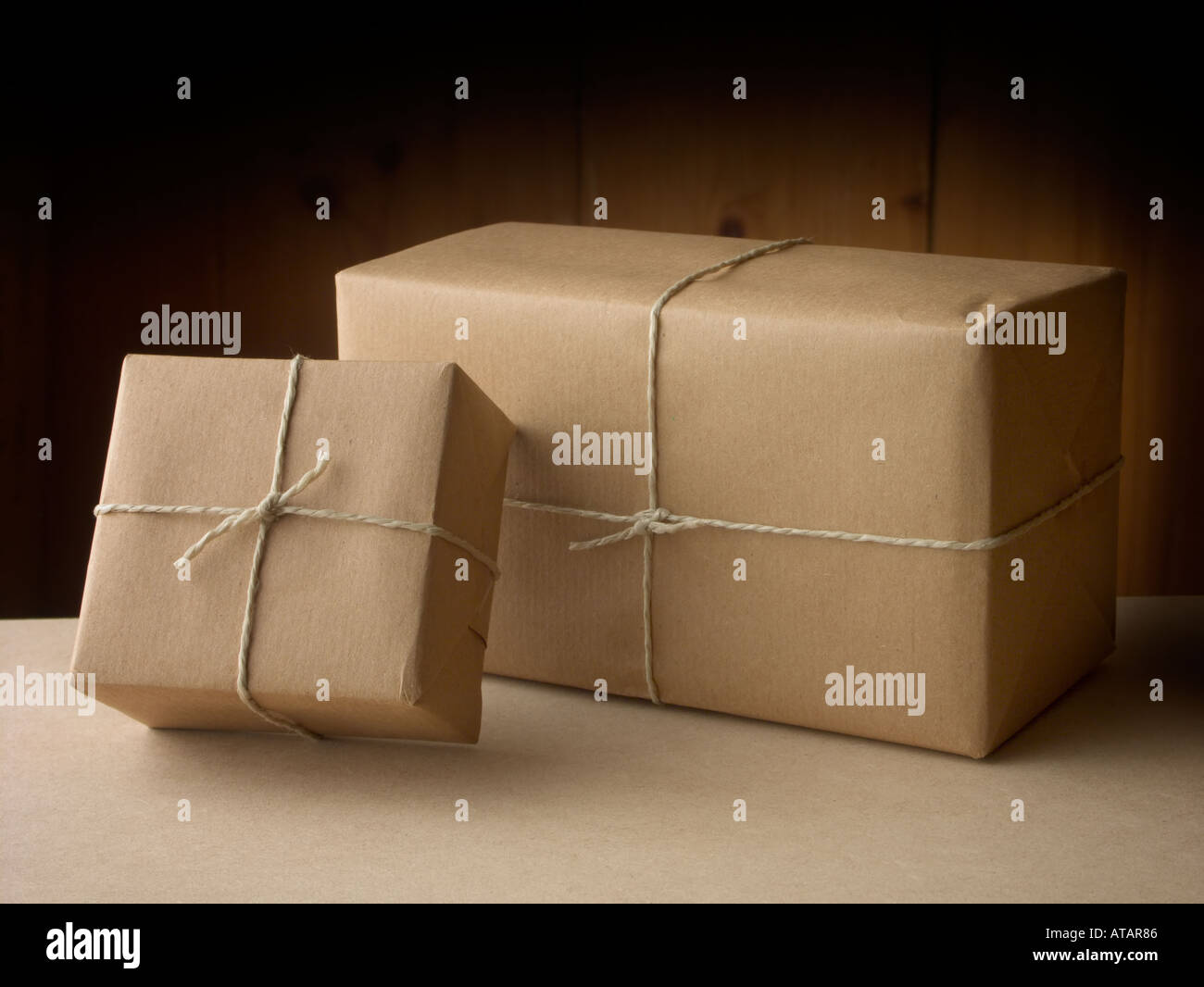 Brown paper parcels tied up with string Stock Photo - Alamy