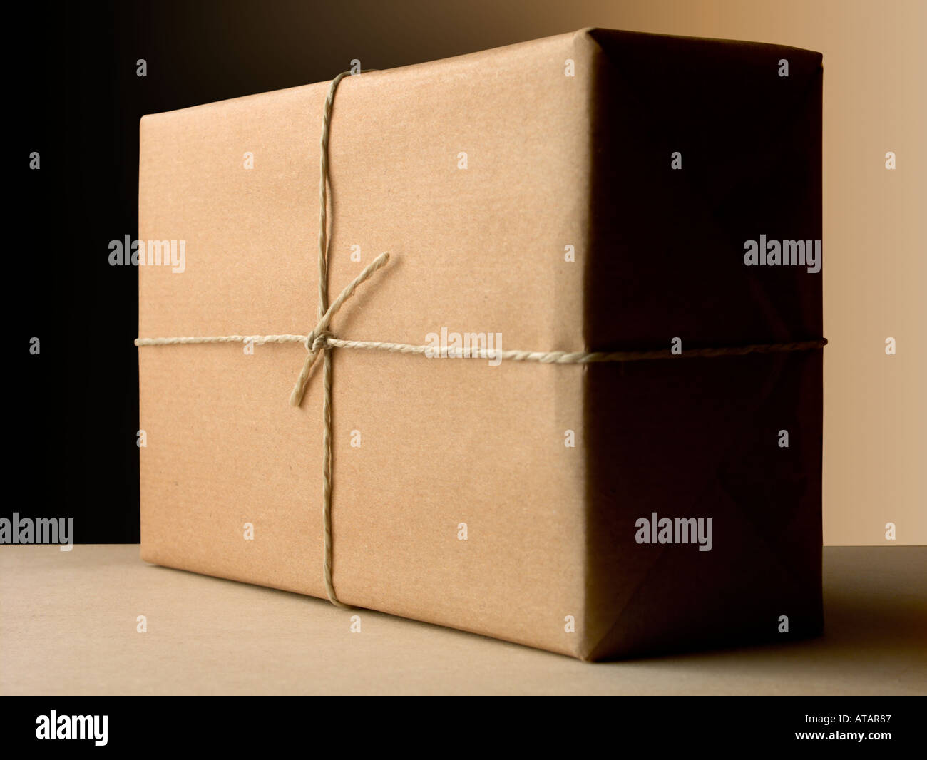 Brown paper parcel tied up with string Stock Photo - Alamy