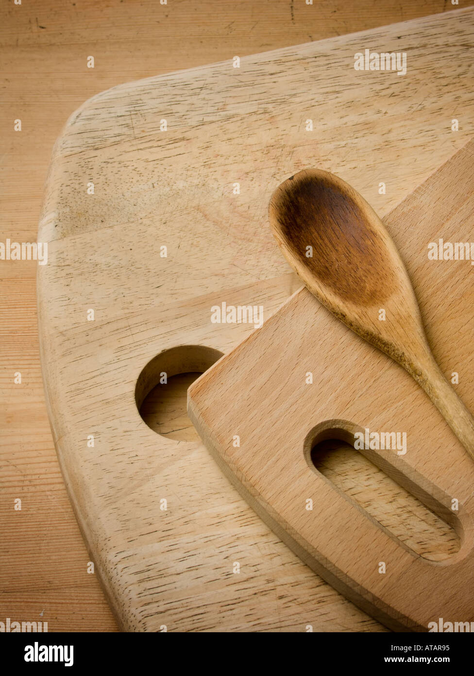 Wooden spoon on chopping board Stock Photo - Alamy