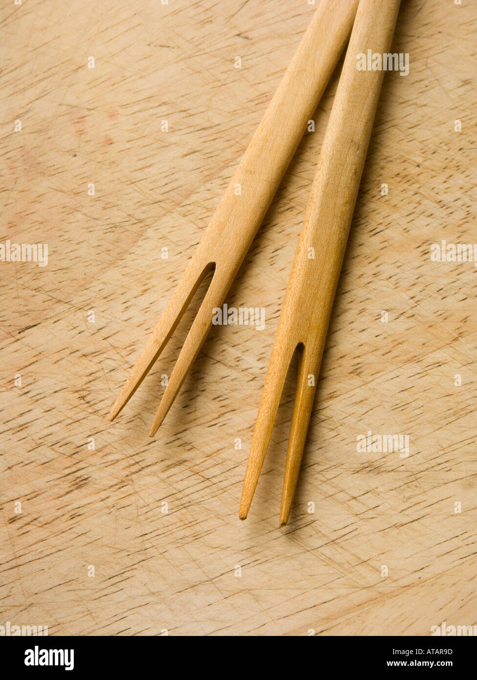 wooden forks on chopping board Stock Photo - Alamy