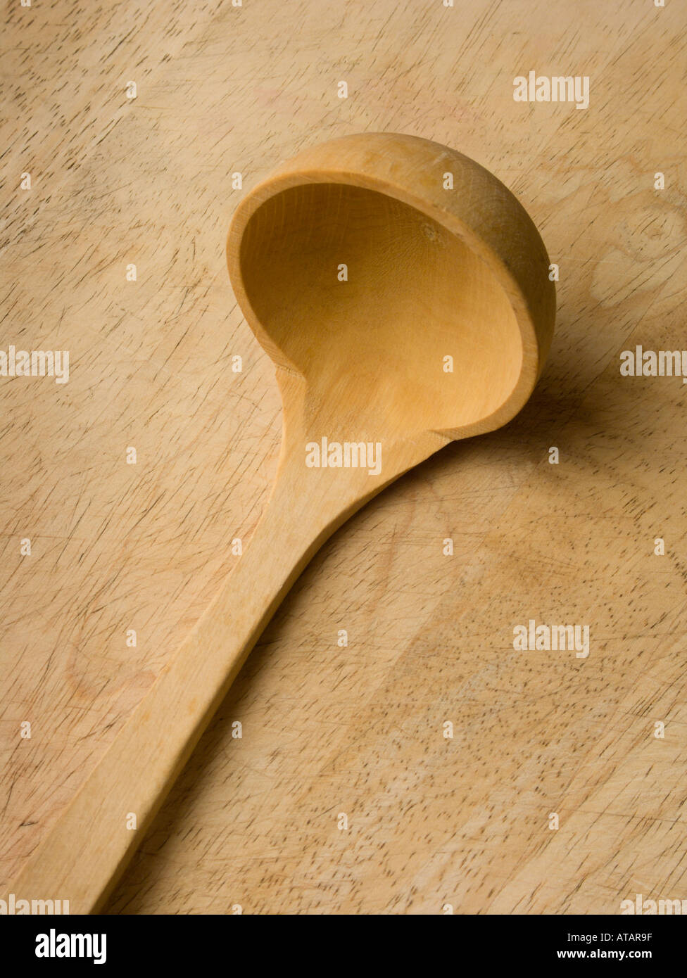 wooden ladle on chopping board Stock Photo - Alamy