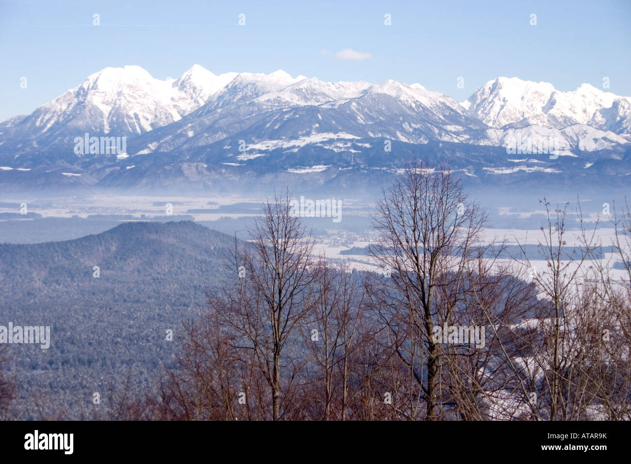 View of Kamnik Alps from top of Smarna Gora Mountain in winter on the ...