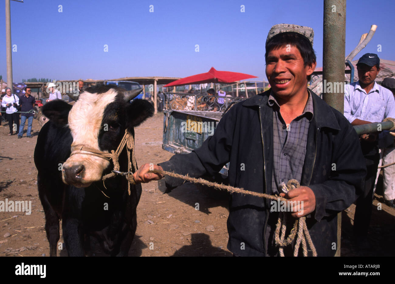 Animal merchant at the Kashgar Sunday Market Xinjiang Province China ...