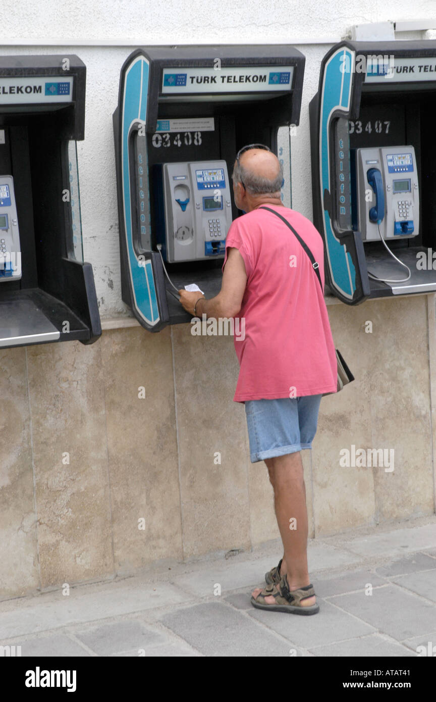 Using a public telephone on the streets of Bodrum in Turkey Stock Photo ...