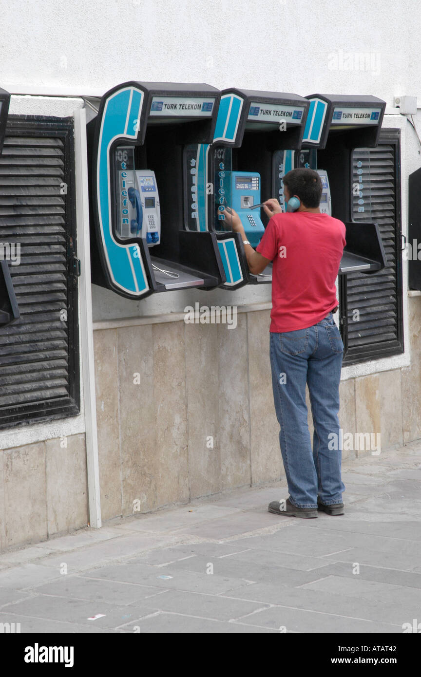Using a public telephone on the streets of Bodrum in Turkey Stock Photo ...