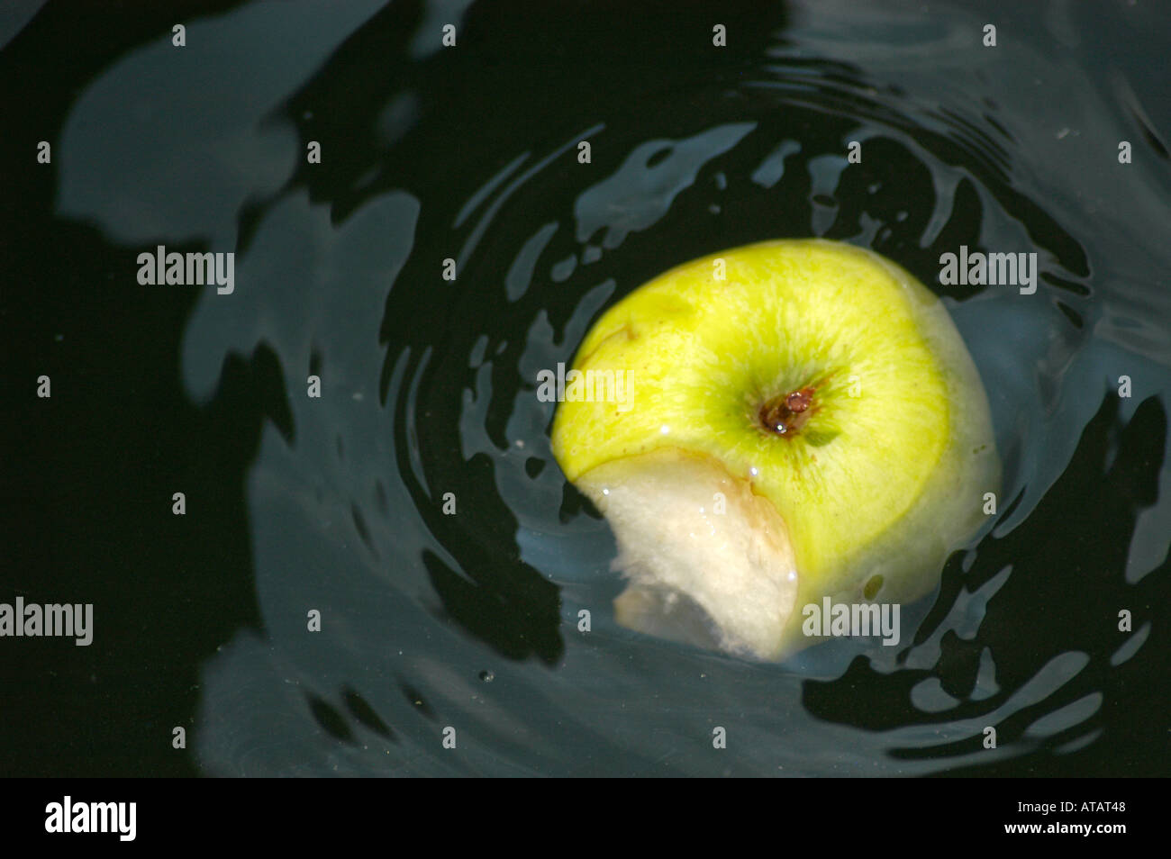 Green bitten apple in hi-res stock photography and images - Alamy