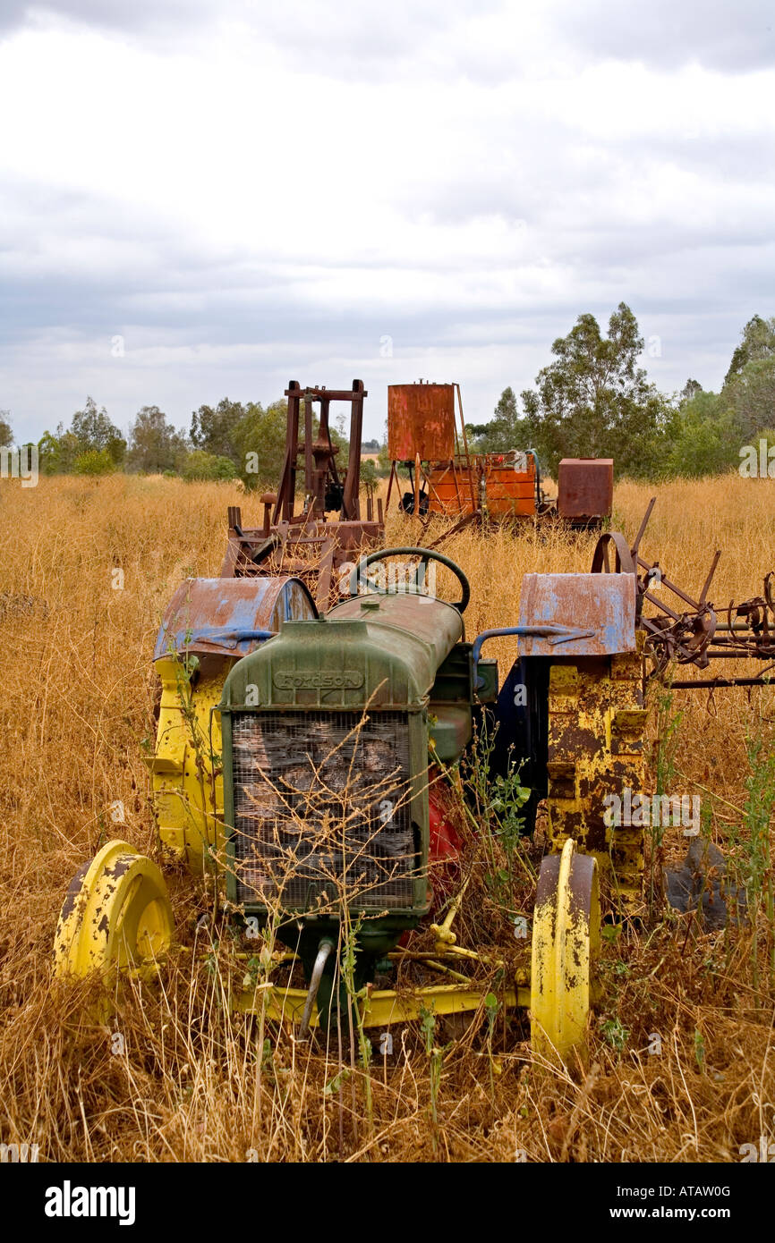 Vintage tractor and machinery abandoned in a field outback Australia ...