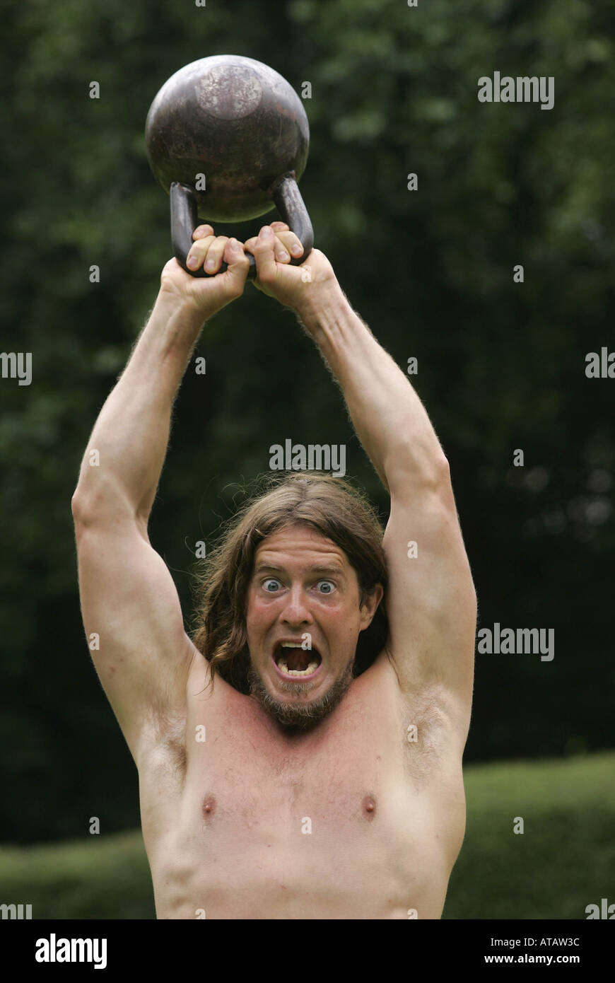 Comedian Craig Campbell working out in his garden in Devon Stock Photo ...