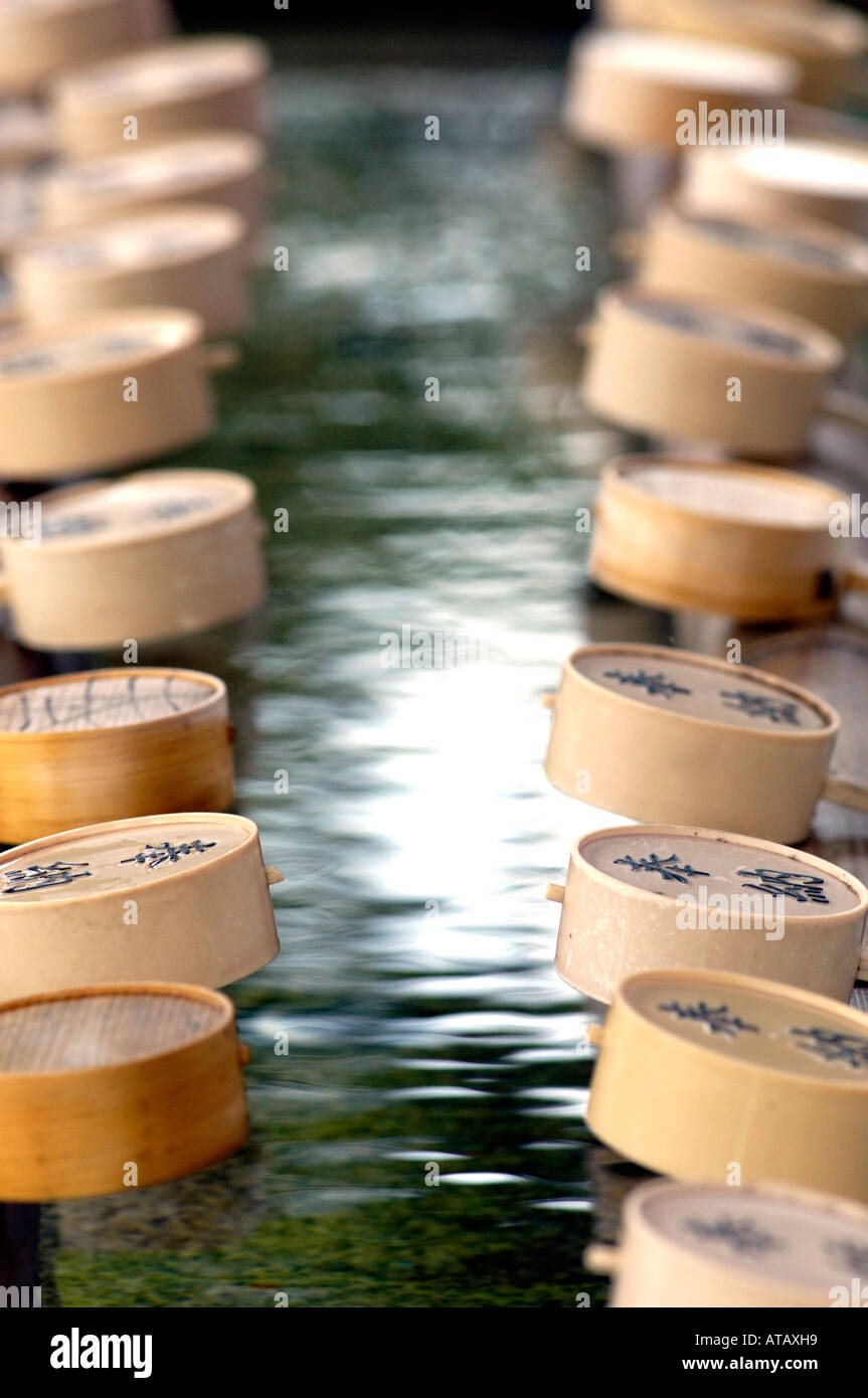 Double row of water ladles Fushimi Inari Shrine Kyoto Japan Stock Photo ...