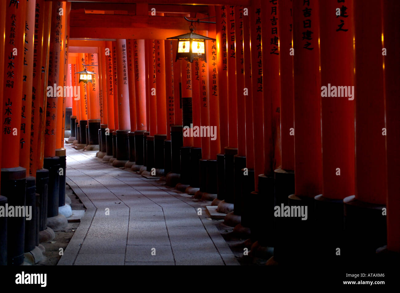 A path lined with Torii gates Fushimi Inari Shrine Kyoto Japan Stock ...