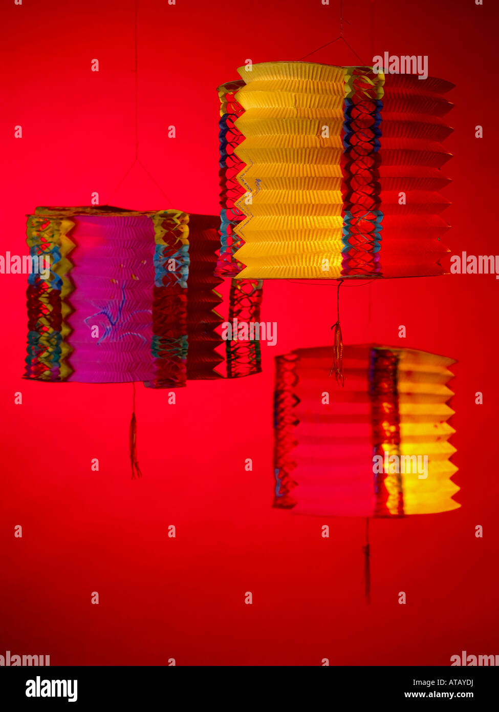 3 lanterns with red background Stock Photo - Alamy