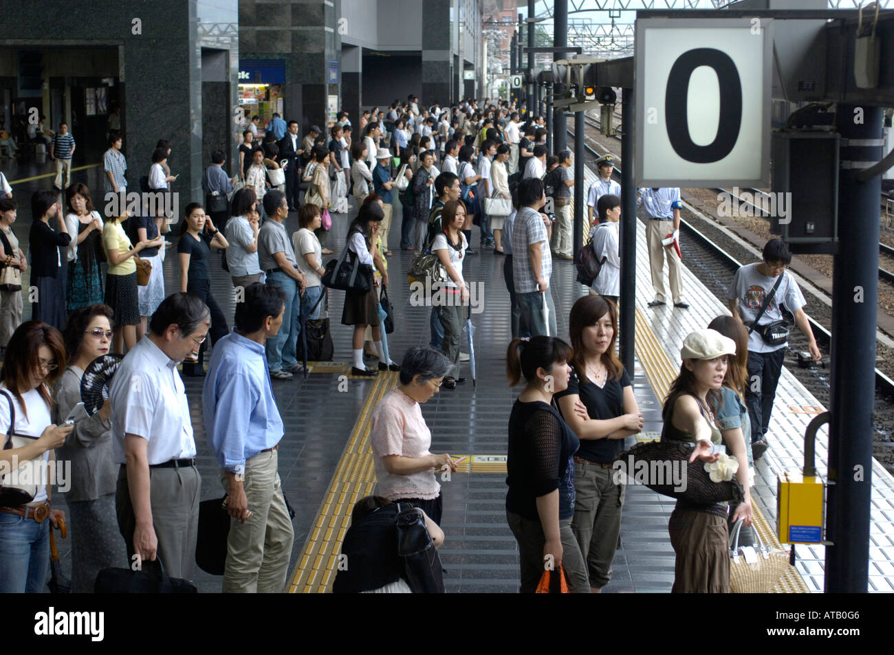 Passengers queuing up for the train at Kyoto Station Kyoto Japan Stock ...