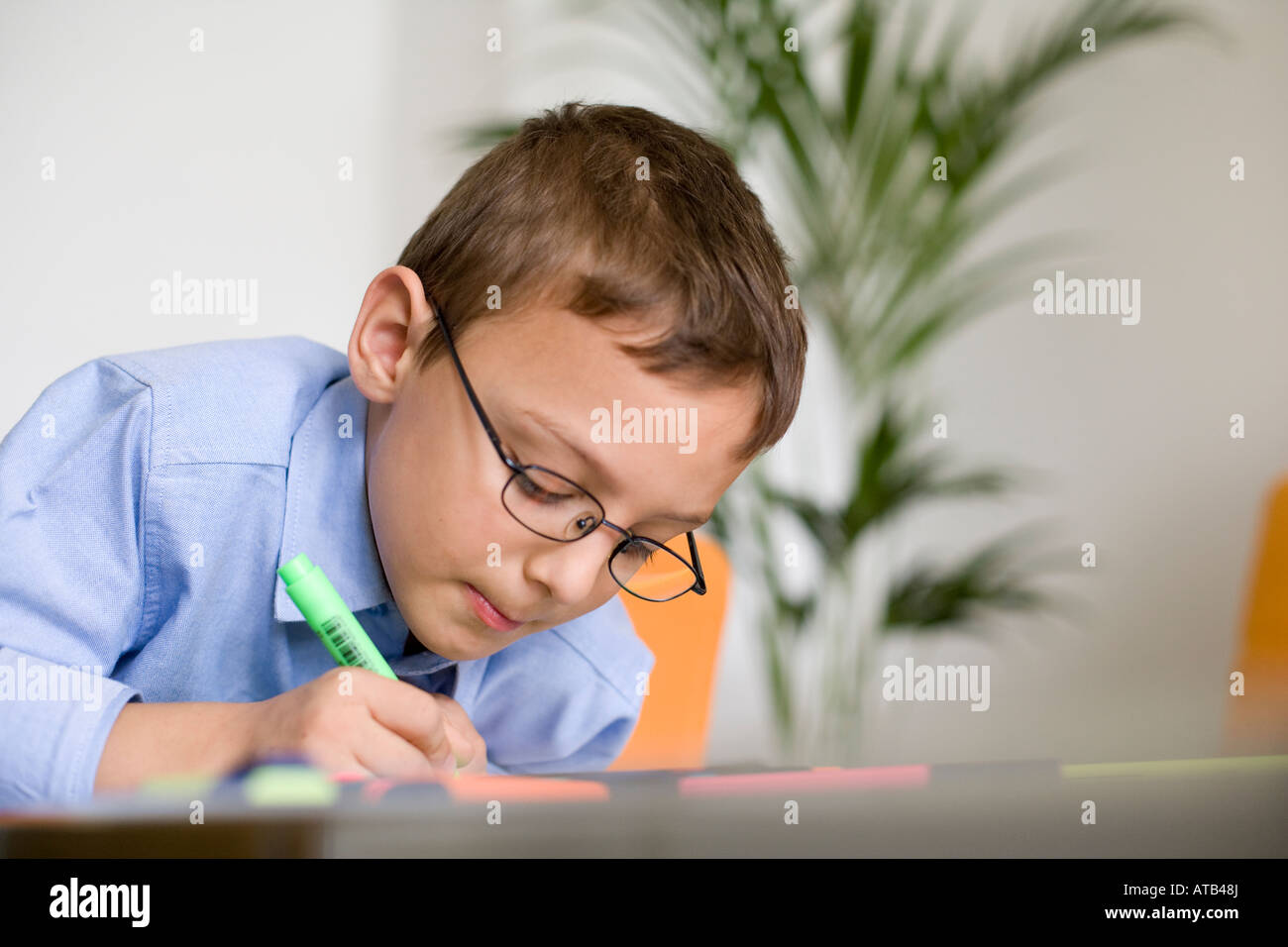 a boy drawing in his home intrerior Stock Photo - Alamy
