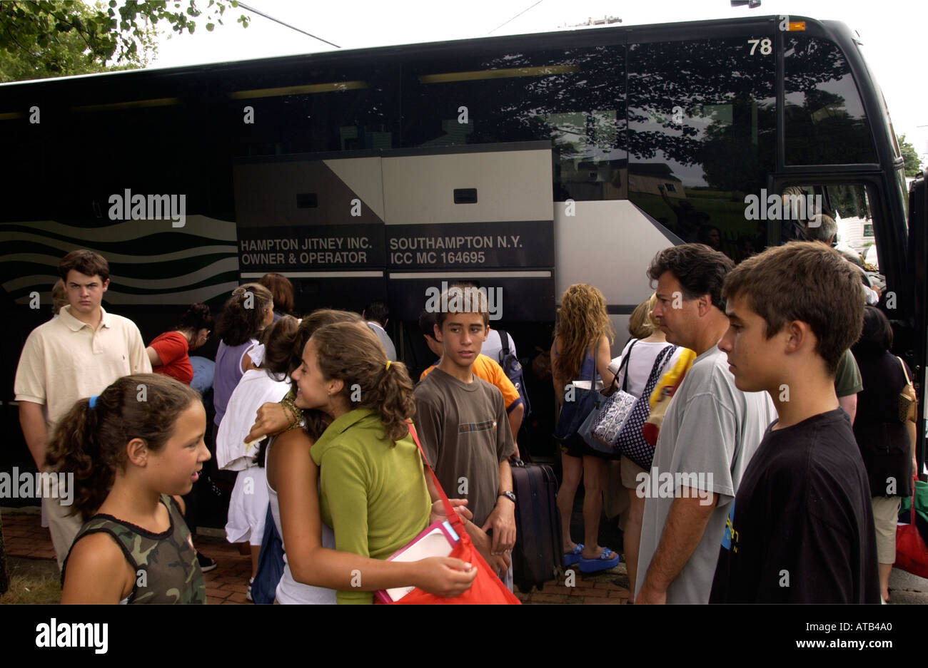 Bridgehampton NY 081201 Riders wait to board The Hampton Jitney to go ...