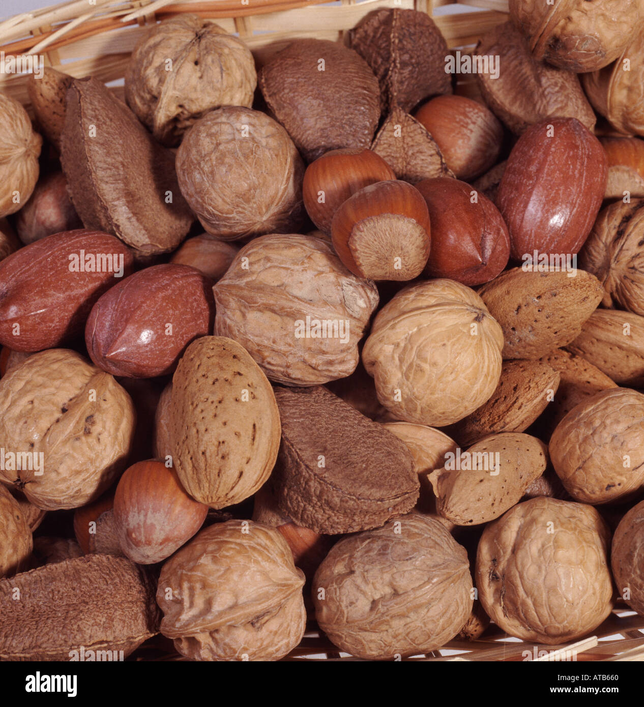 Mixed nuts in a basket hazel walnut pecan almond and brazil Stock Photo ...