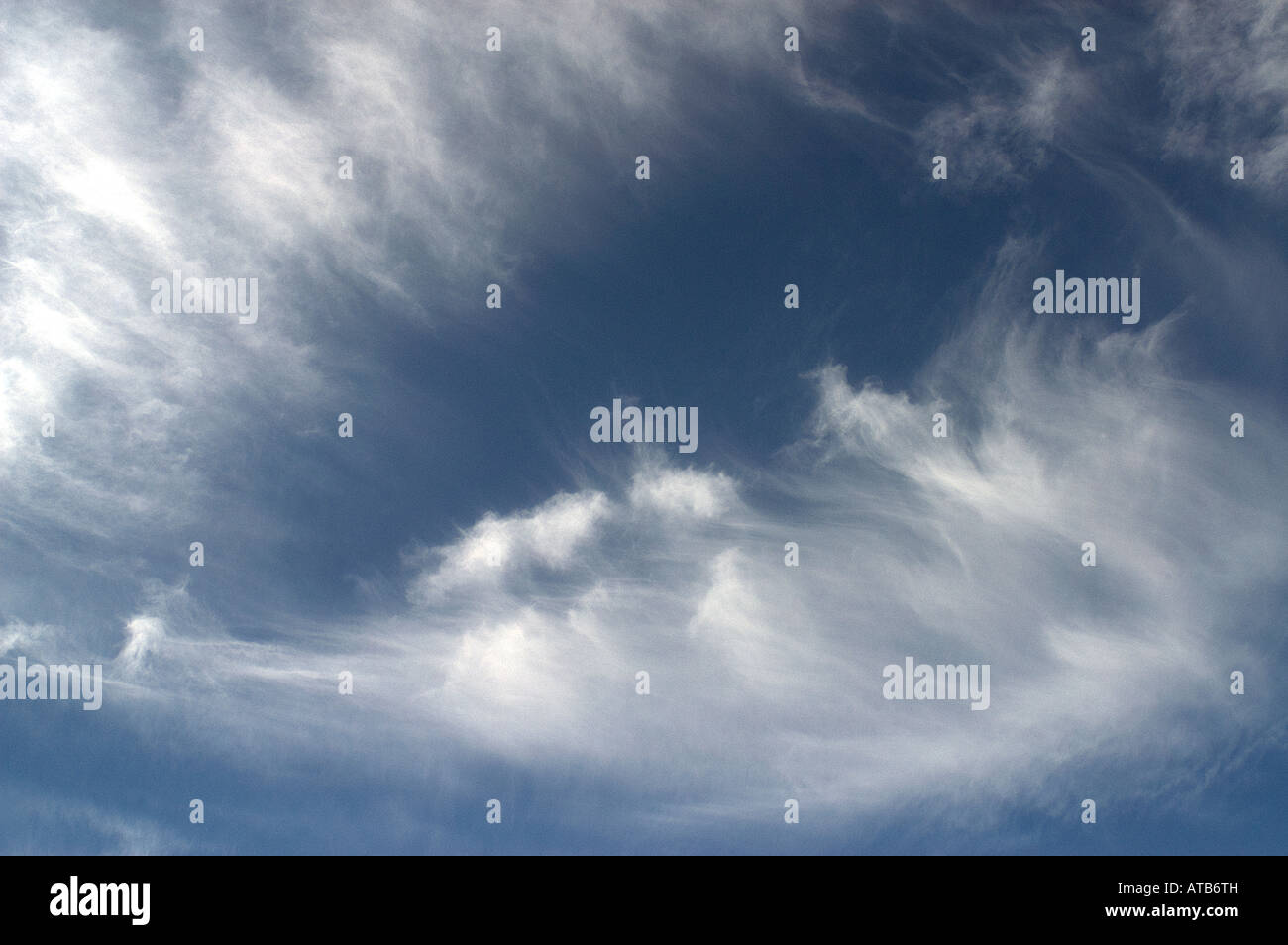 wispy cirrus marestail clouds move across the blue sky Stock Photo - Alamy