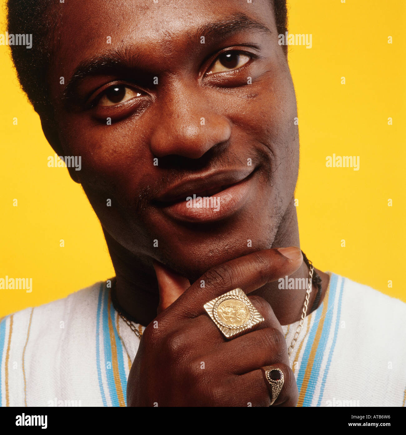 A portrait of a black male hand to chin Stock Photo - Alamy