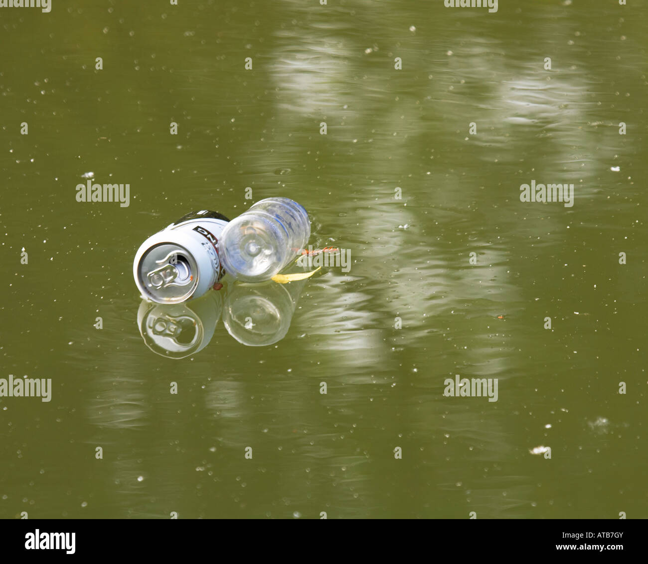 Litter floating in a canal Stock Photo - Alamy